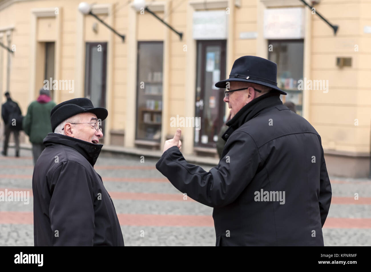 Two elderly people talking. Rear view. From behind. Real people. Head ...