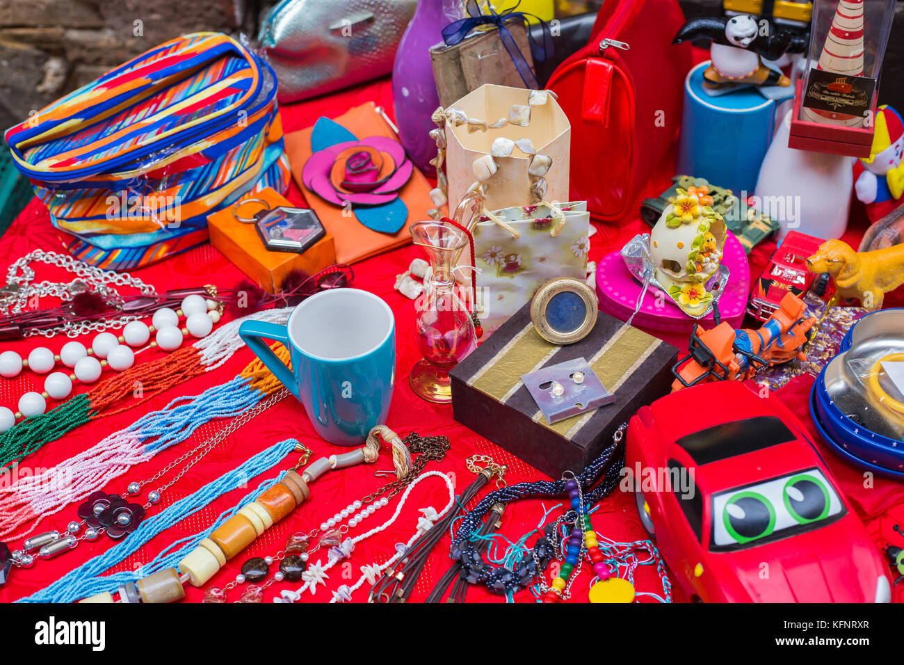 Colored objects for sale on a stall in Italy Stock Photo - Alamy