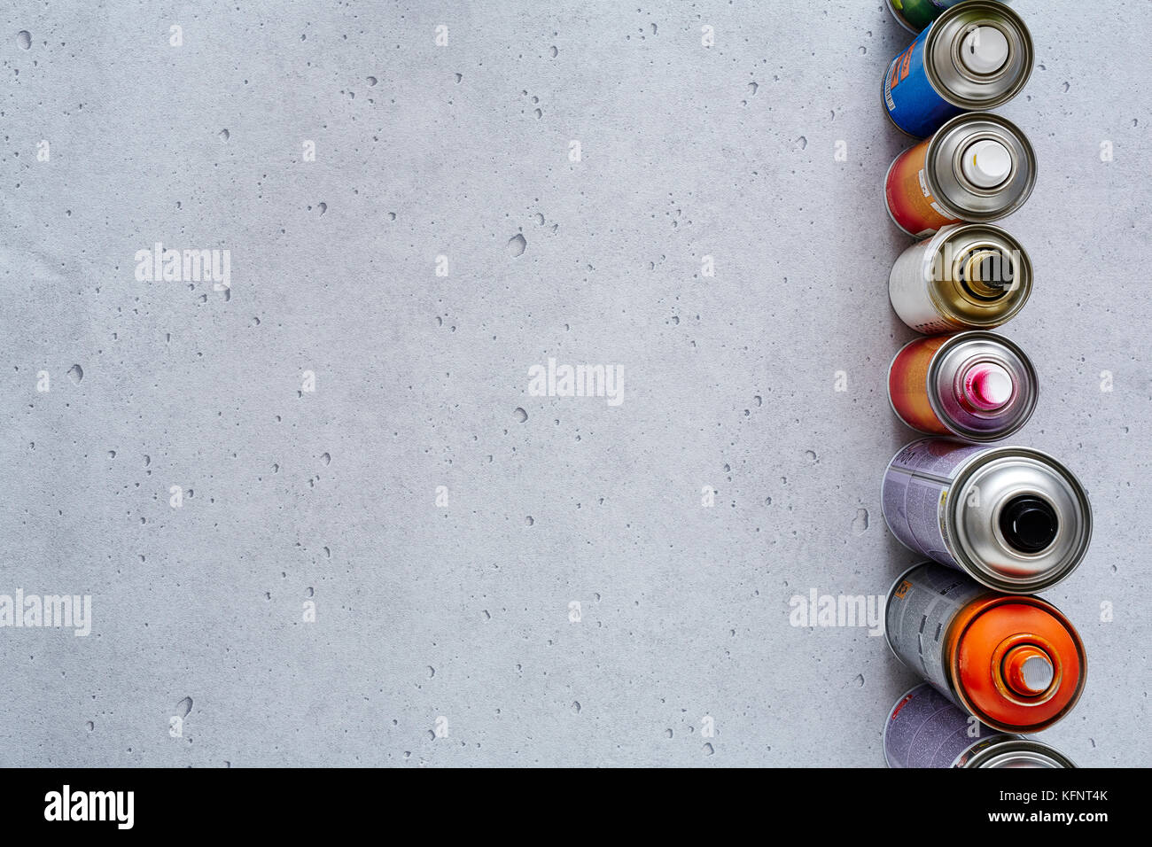 spray cans in lined up on concrete Stock Photo - Alamy