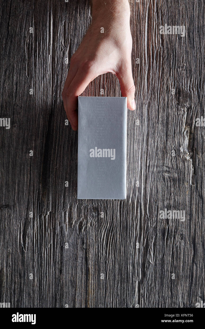 hand holding unbranded box from top mail transportation Stock Photo - Alamy