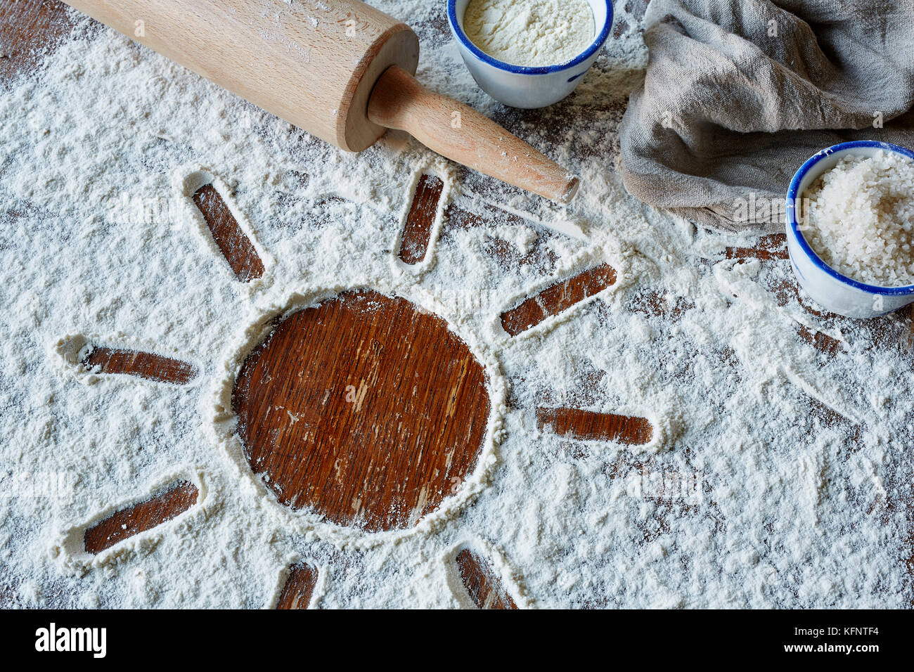 sun symbol in flour with utensils for baking Stock Photo - Alamy