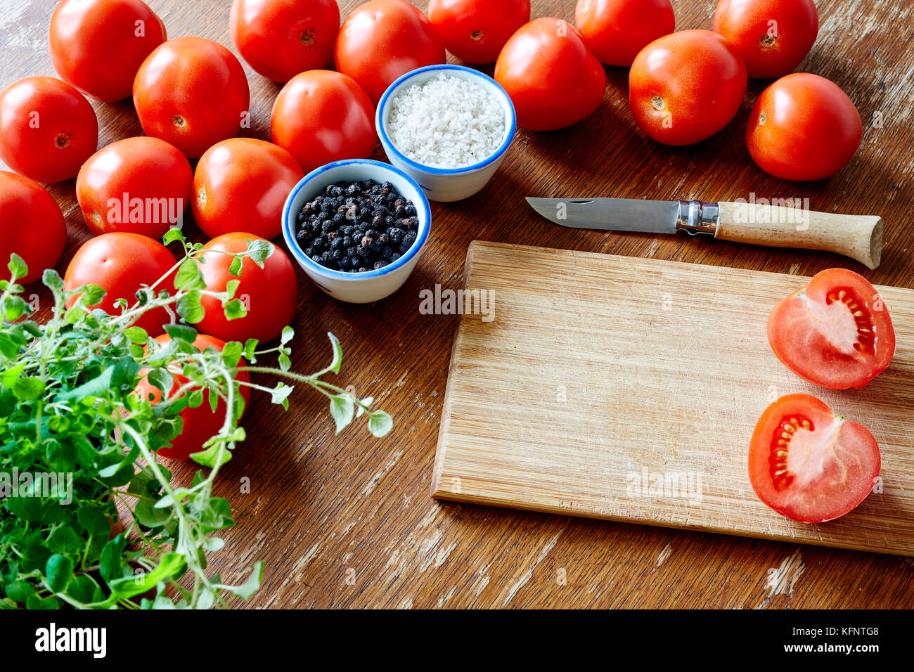 a lot of tomatoes in kitchen scene Stock Photo - Alamy
