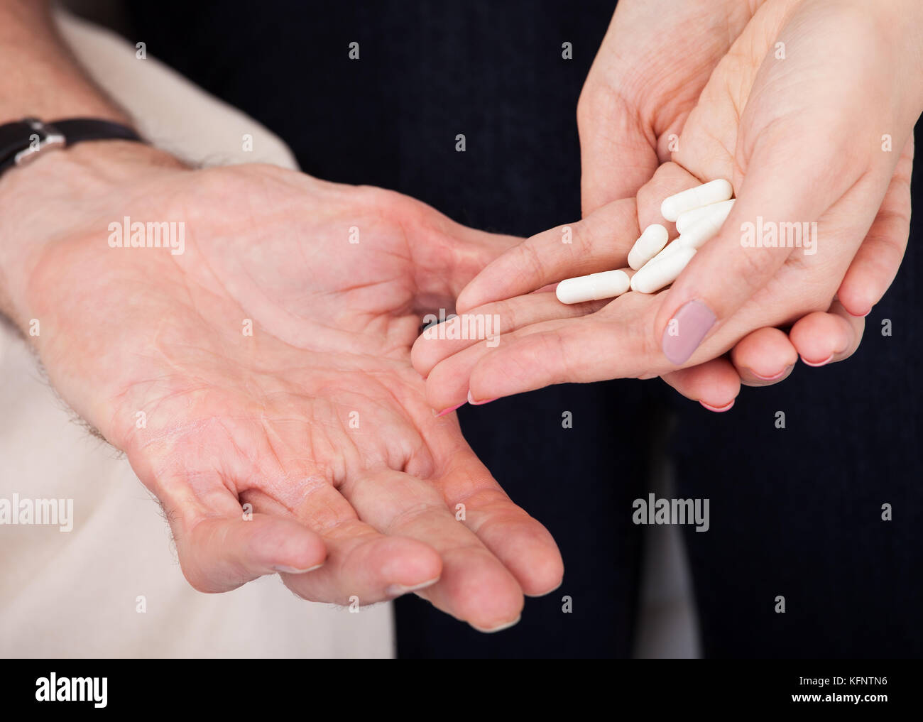 Close-up Of Doctor Hand Giving Medicine To Patient Stock Photo - Alamy