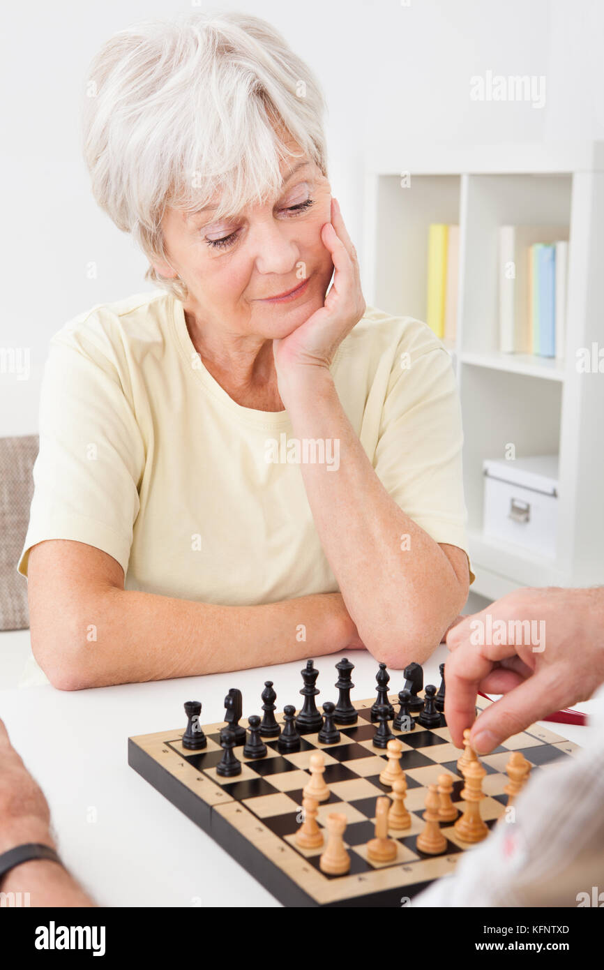 Senior Woman Playing Chess With Her Husband Stock Photo - Alamy