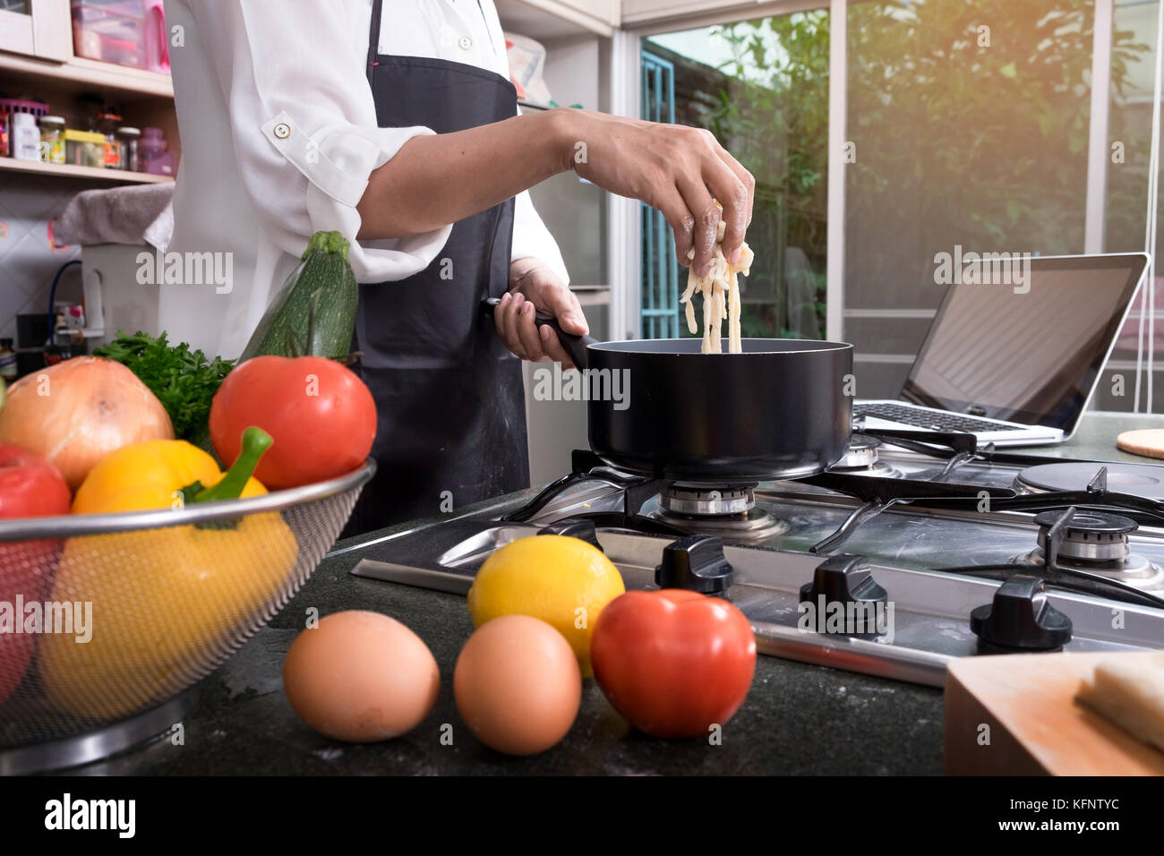 Chef Cutting cook Homemade makes dough fresh Pasta Stock Photo - Alamy