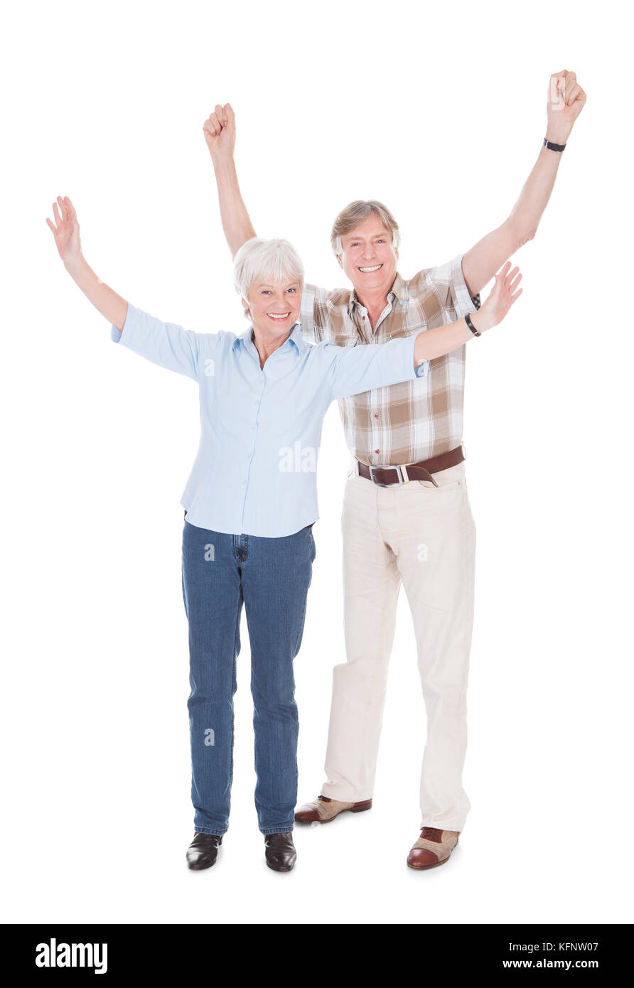 Happy Senior Couple Raising Hand Over White Background Stock Photo - Alamy
