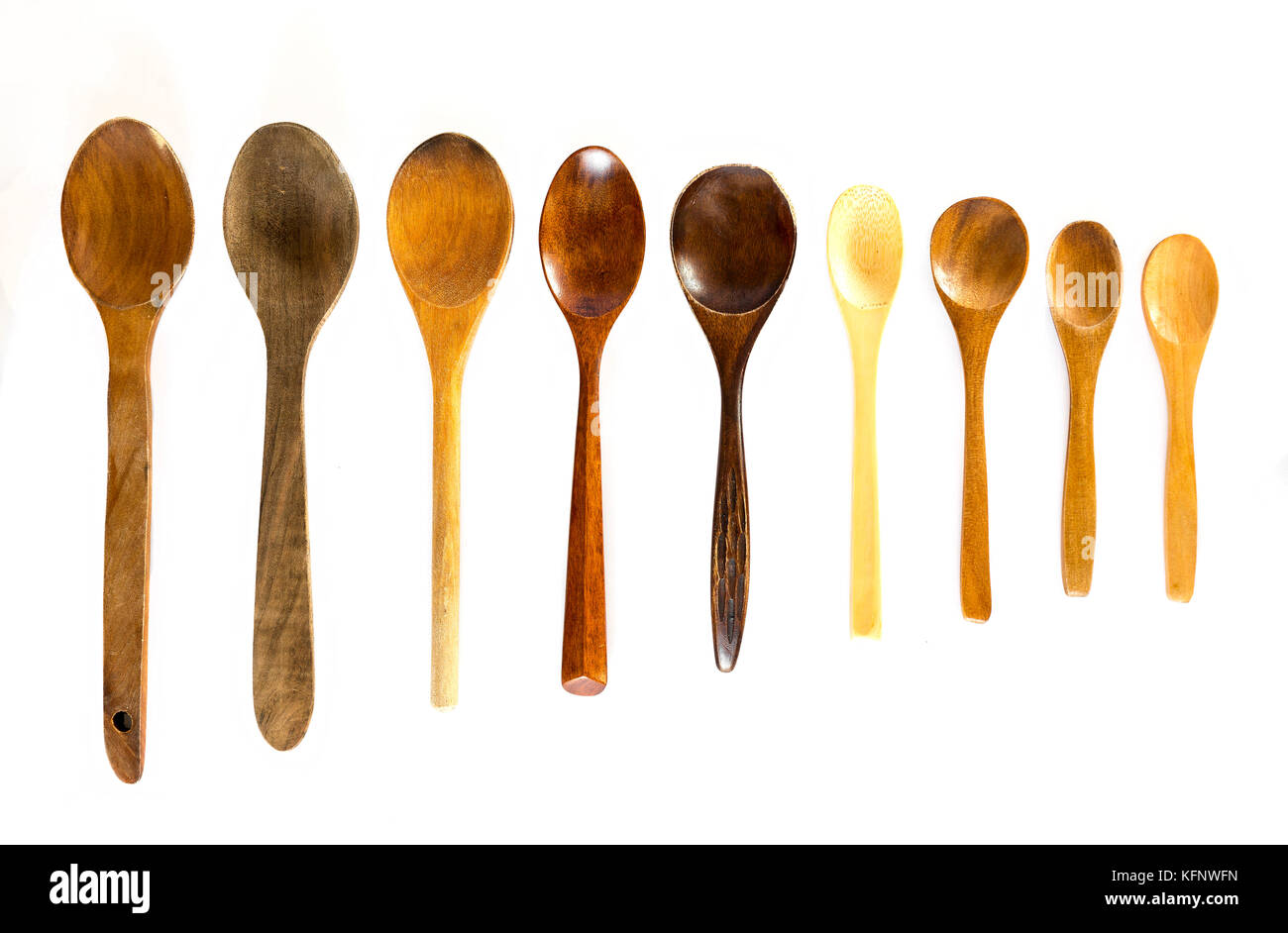 Wooden spoons on a white background. Studio shot. Set of kitchen ...