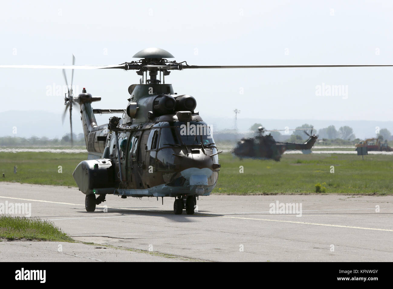 Military helicopters at the runway of the airport Stock Photo - Alamy