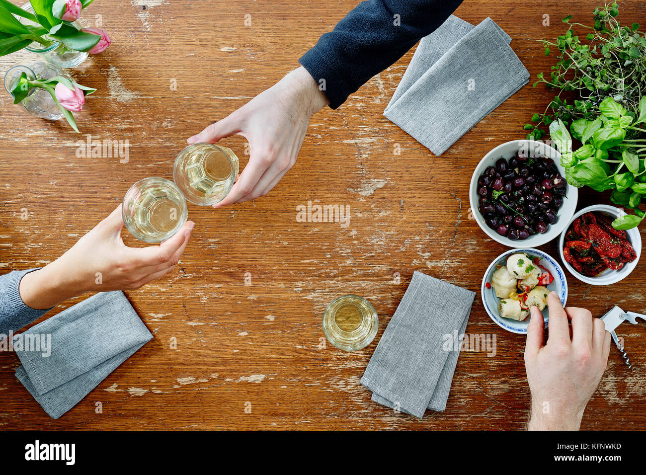 three people interacting at a restaurant table Stock Photo - Alamy