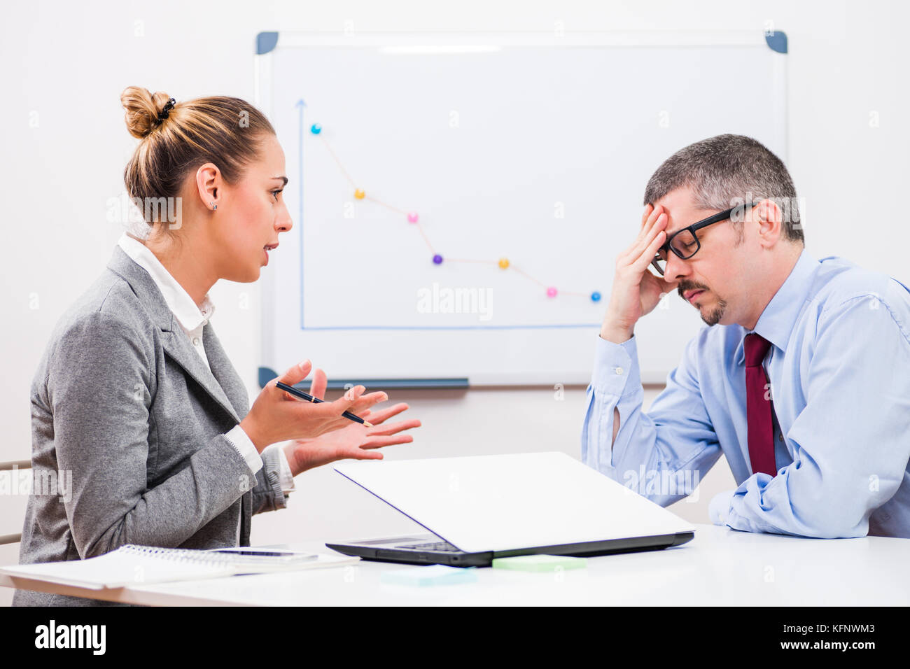 Businessman is getting fired by his boss Stock Photo - Alamy