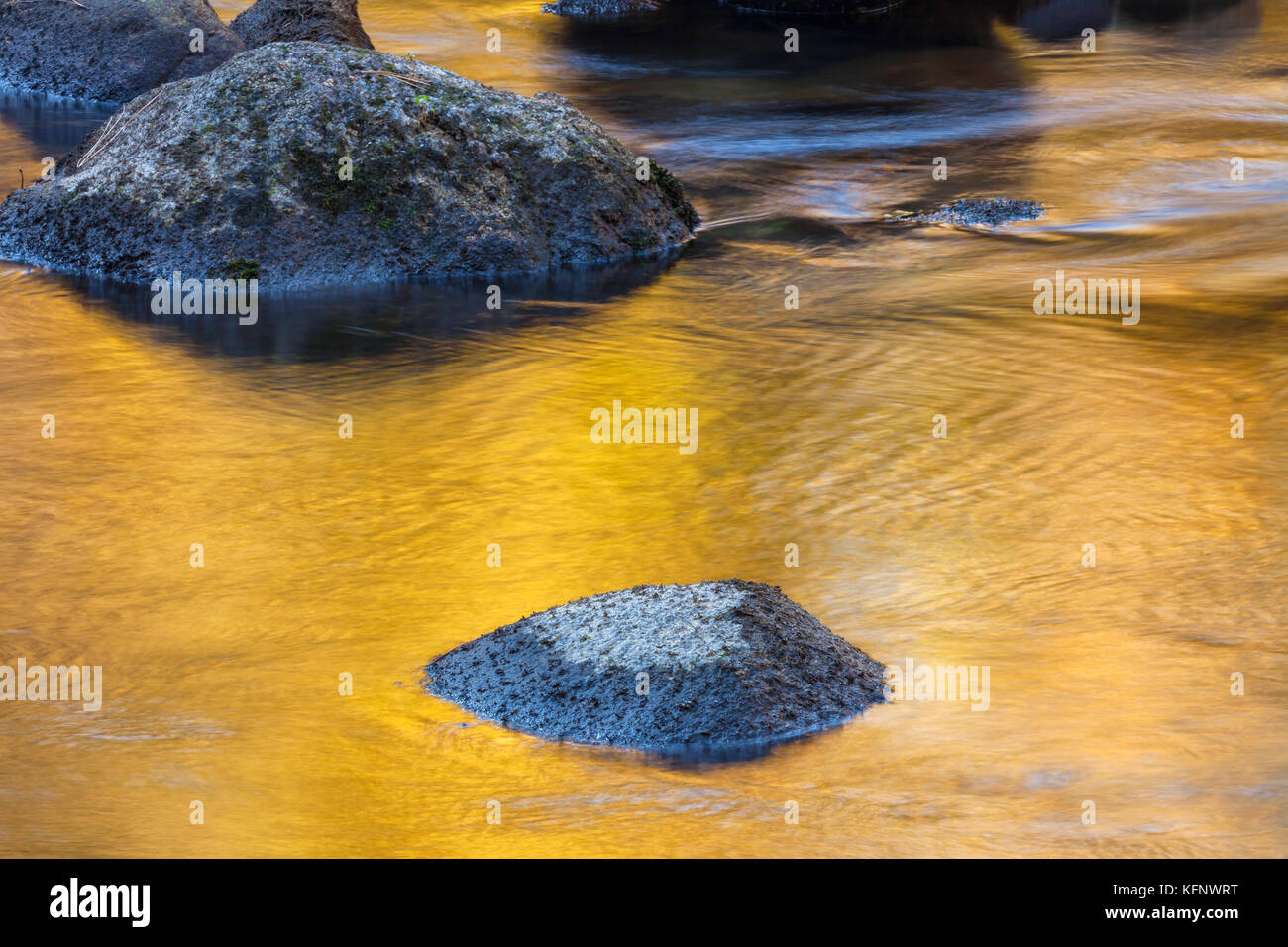 Close up of the rocks and flowing water from the Merced River, with ...