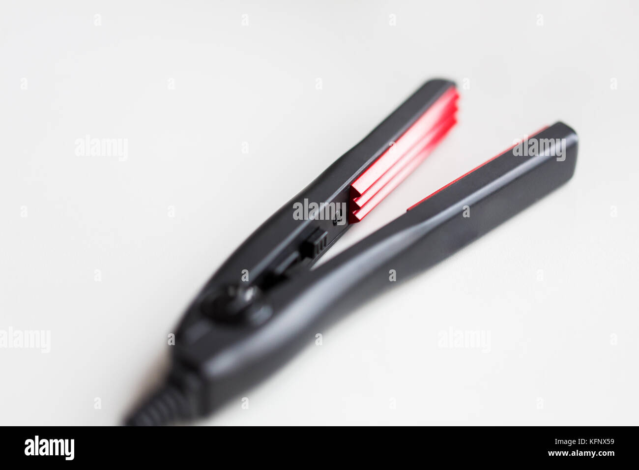 mini crimper on white background Stock Photo - Alamy