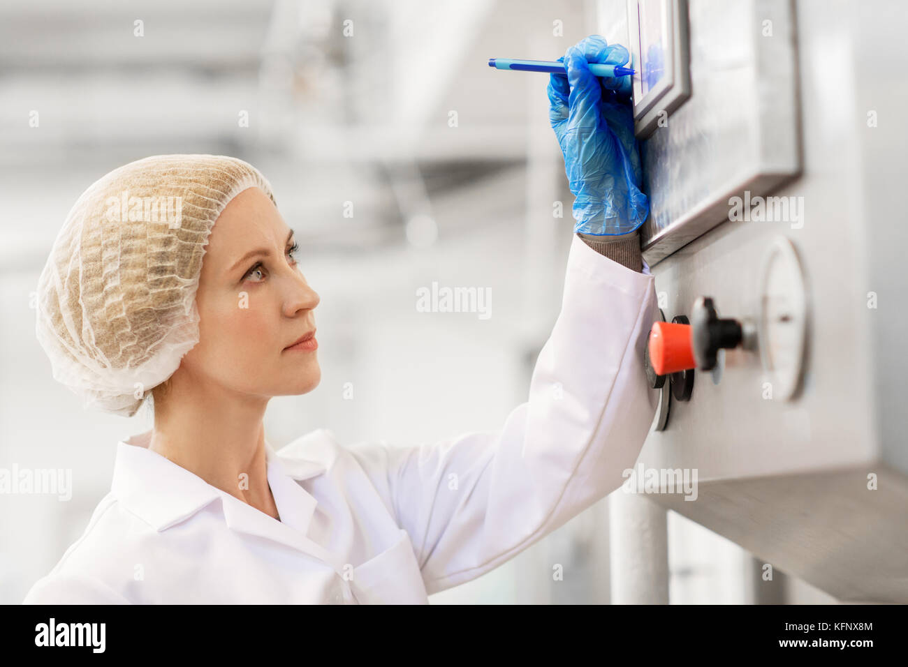 woman programming computer at ice cream factory Stock Photo - Alamy