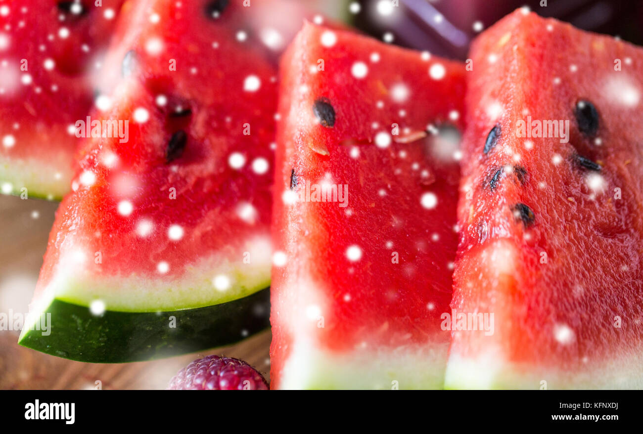close up of watermelon slices over snow Stock Photo - Alamy