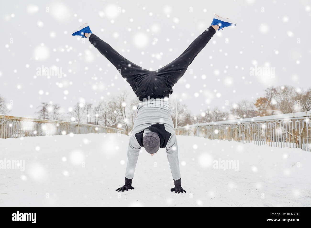 young man doing handstand in winter Stock Photo - Alamy