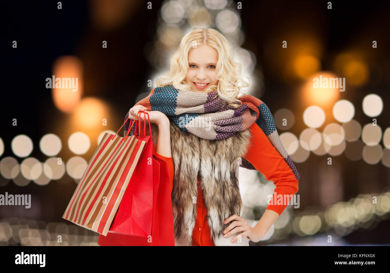 young woman in winter clothes with shopping bags Stock Photo - Alamy