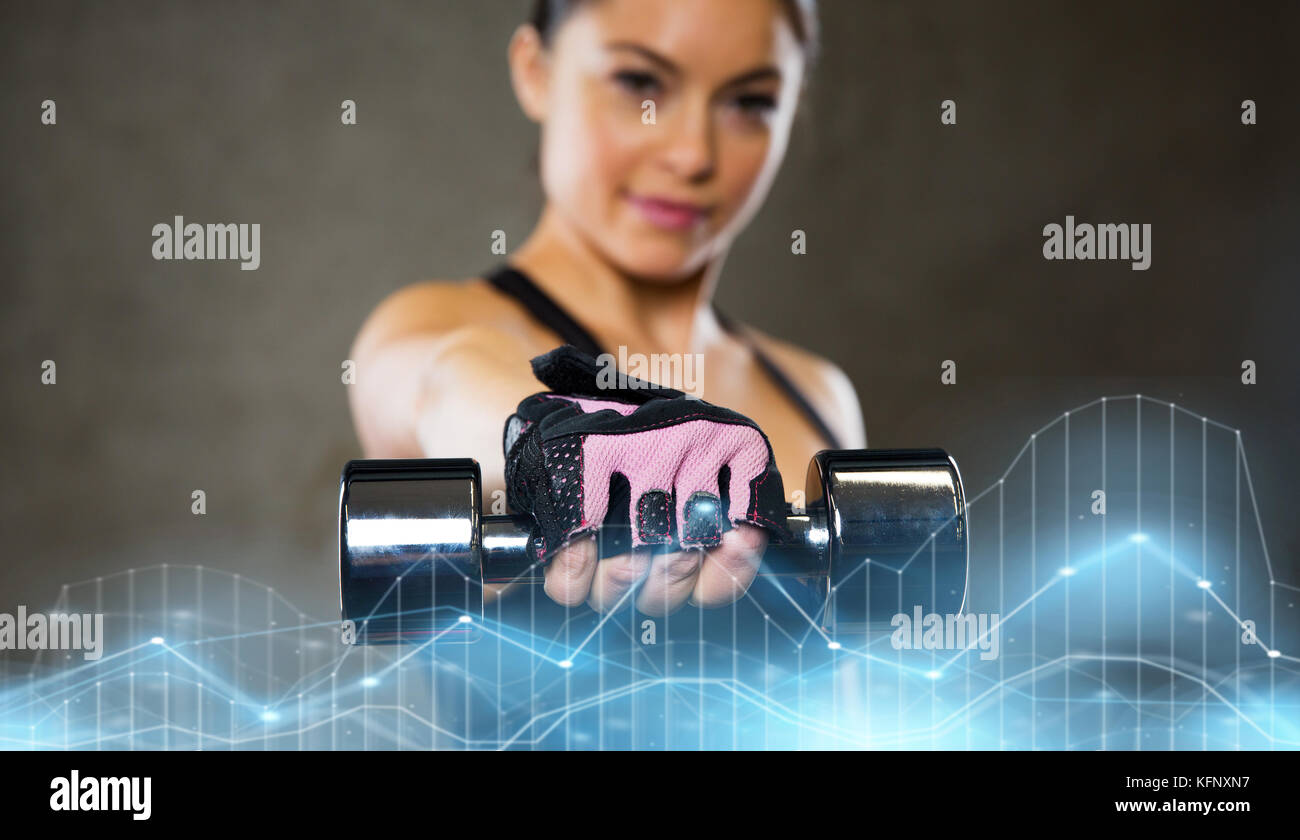 Woman holding dumbbell hi-res stock photography and images - Alamy