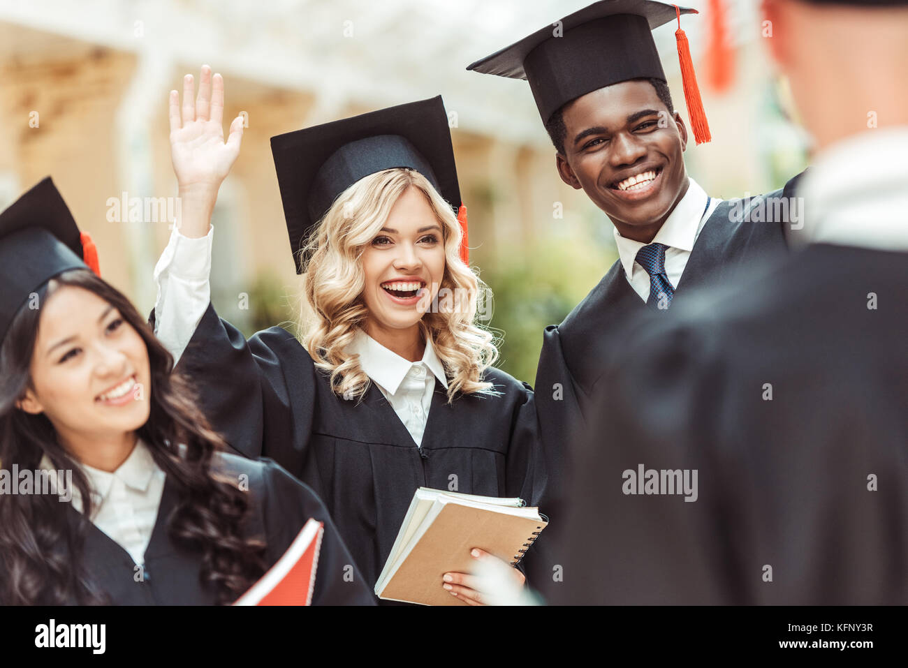 students in graduation costumes Stock Photo - Alamy