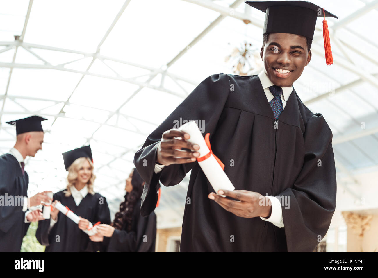 graduated student showing diploma Stock Photo - Alamy