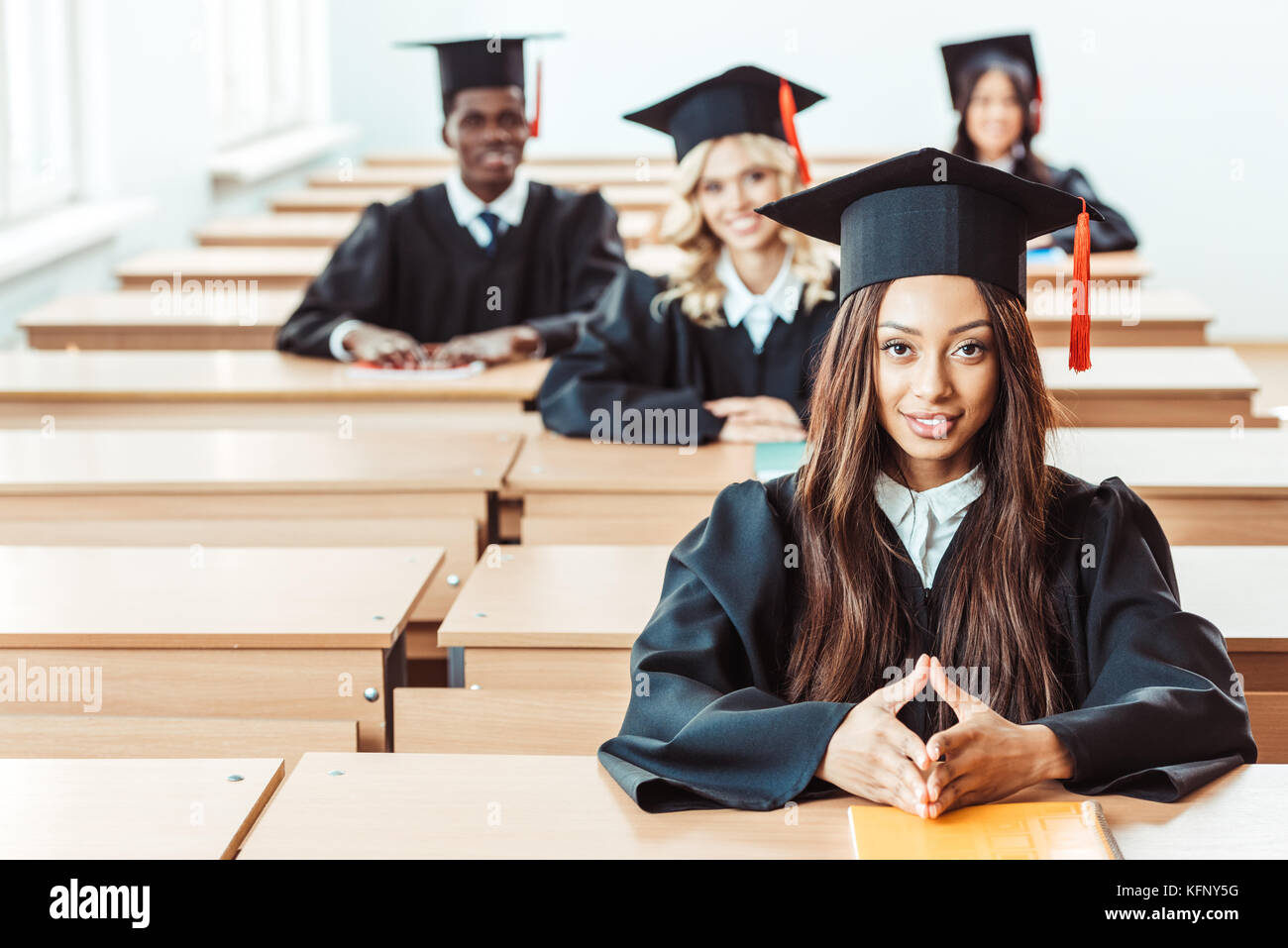 students in graduation costumes Stock Photo - Alamy