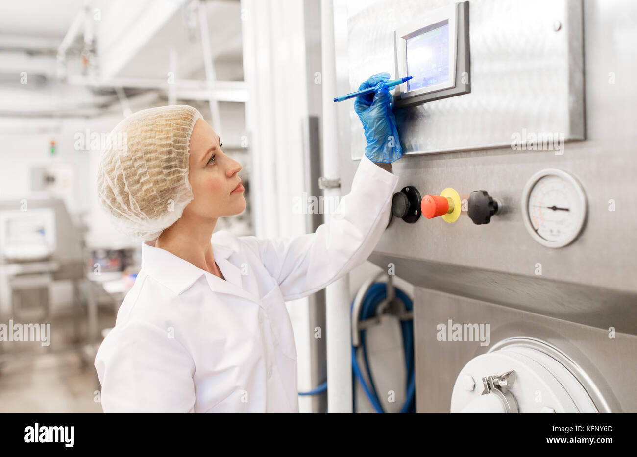 woman programming computer at ice cream factory Stock Photo - Alamy
