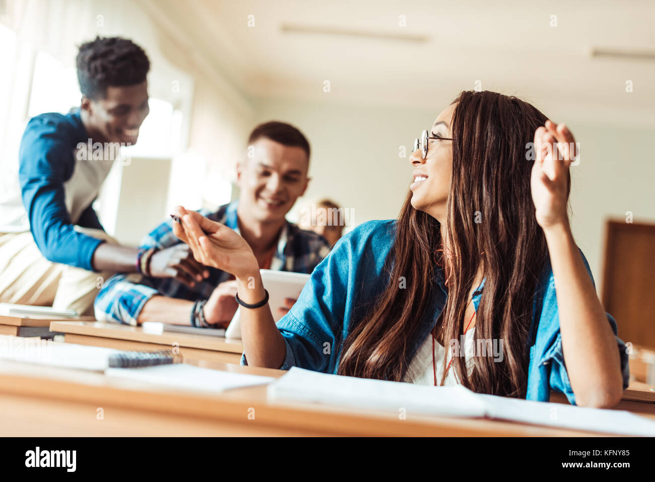 student girl talking to classmates Stock Photo - Alamy