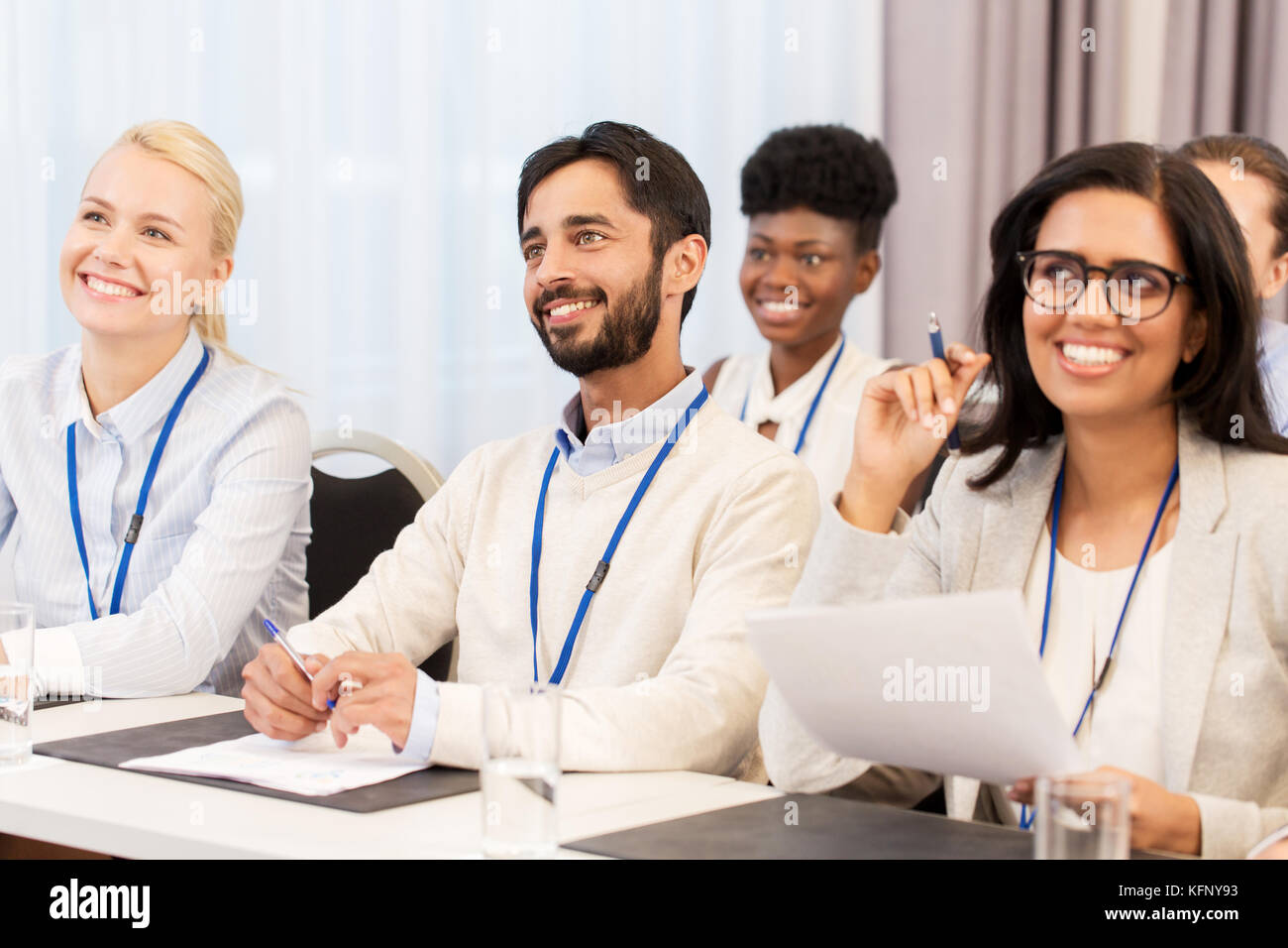 happy business team at international conference Stock Photo - Alamy