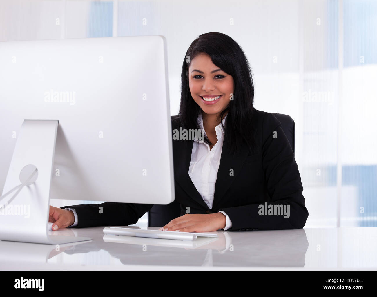 Portrait Of Young Businesswoman Using Computer In The Office Stock ...