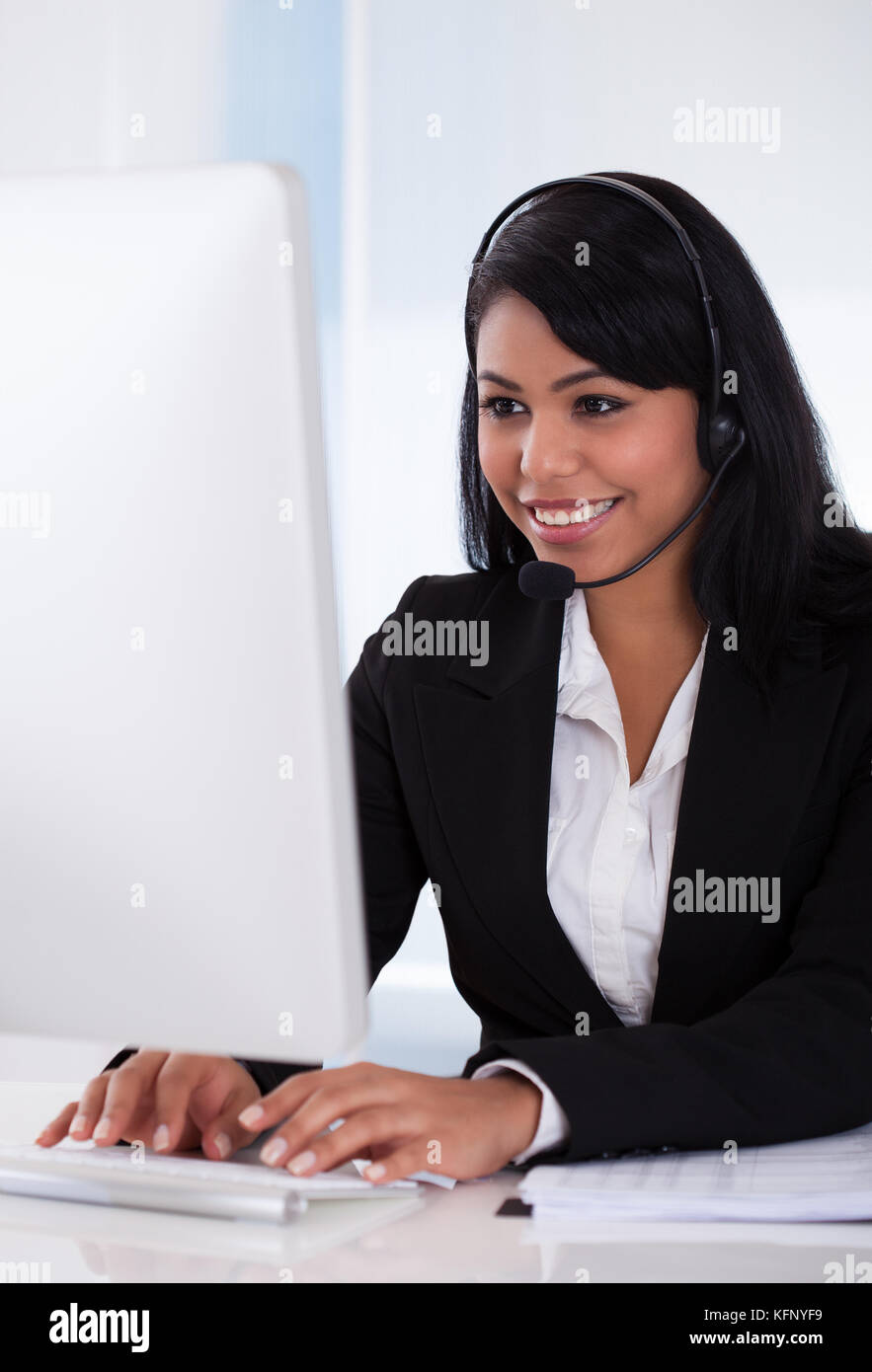 Portrait Of Female Customer Representative Using Computer Stock Photo ...