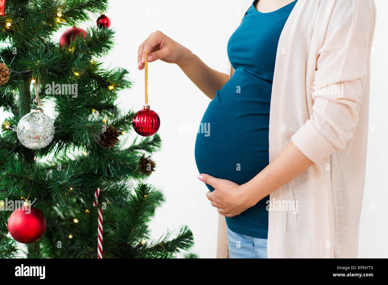 Pregnant woman decorating room hi-res stock photography and images - Alamy