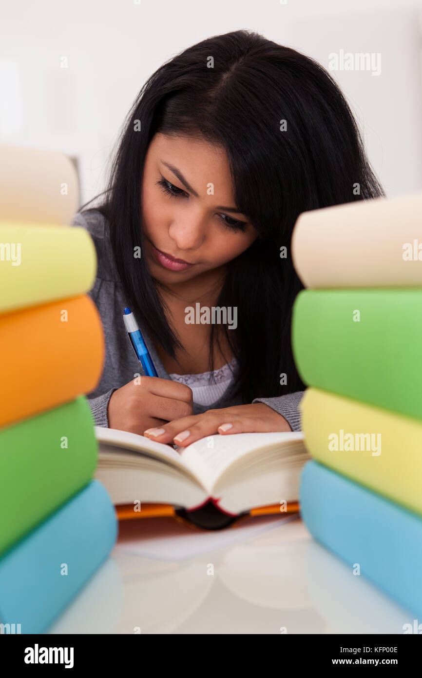 Portrait Of Young Happy Woman Studying At Home Stock Photo - Alamy