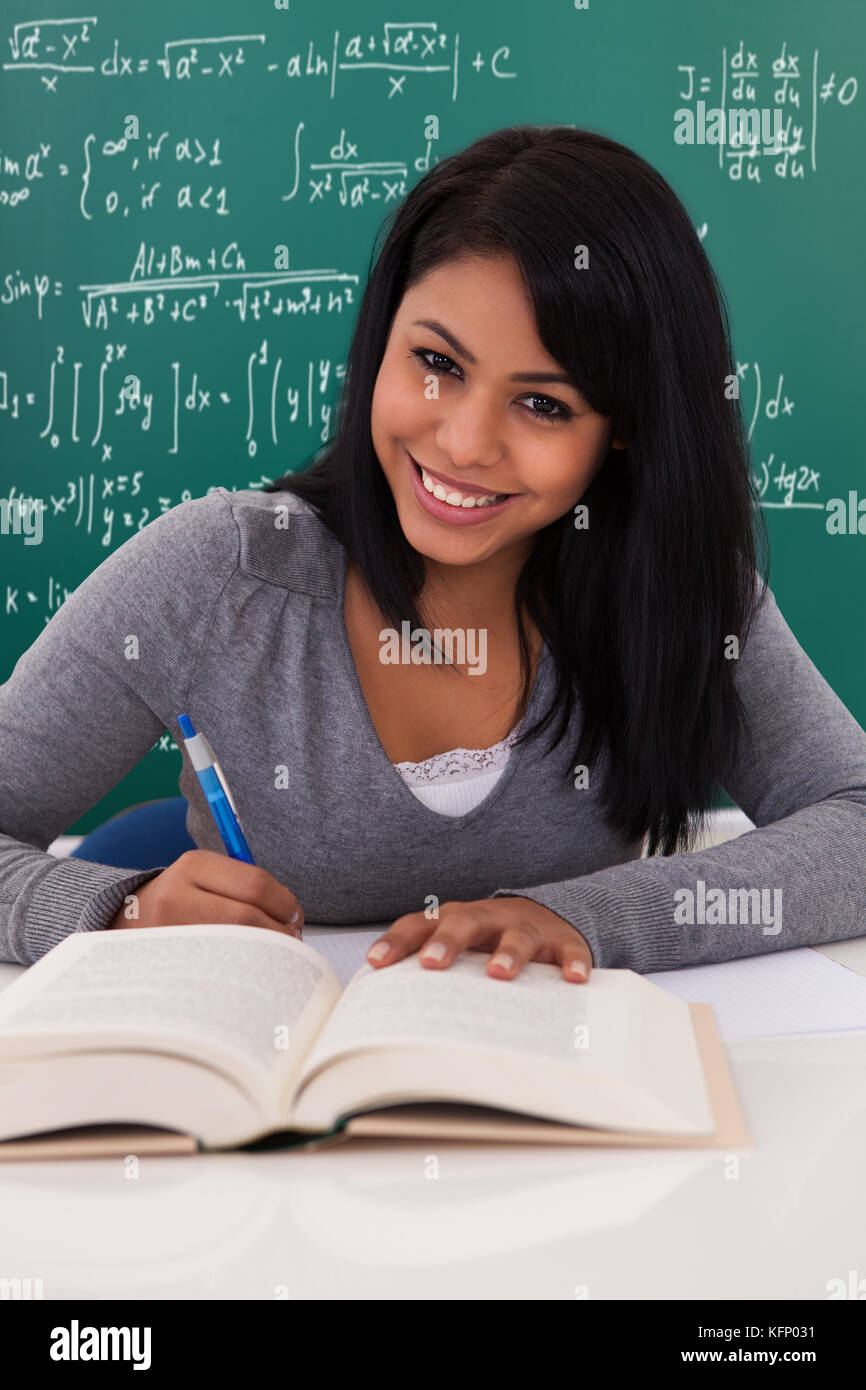 Female student studying in classroom hi-res stock photography and ...
