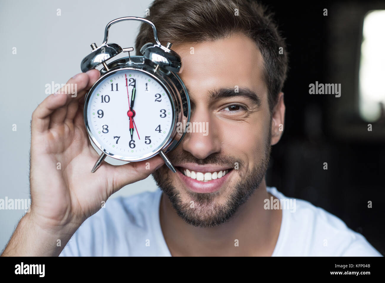 man with alarm clock Stock Photo - Alamy