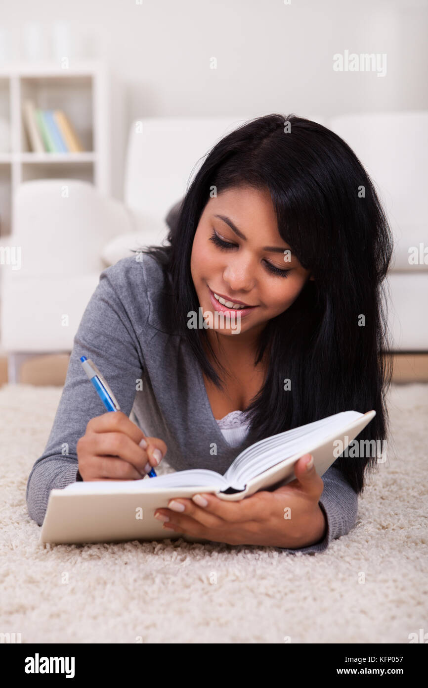 Girl writing in diary hi-res stock photography and images - Alamy