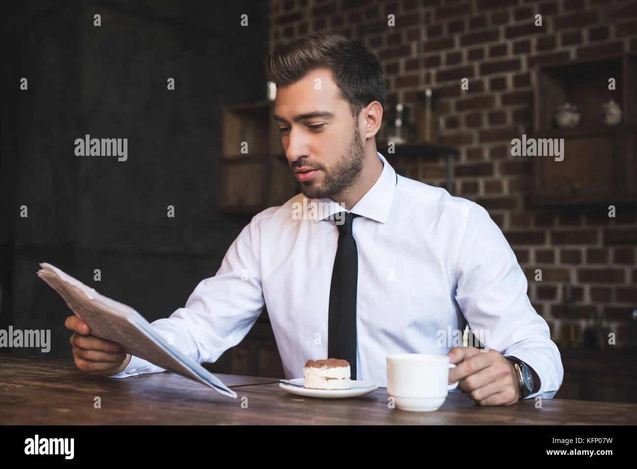 businessman at cafe reading newspaper Stock Photo - Alamy