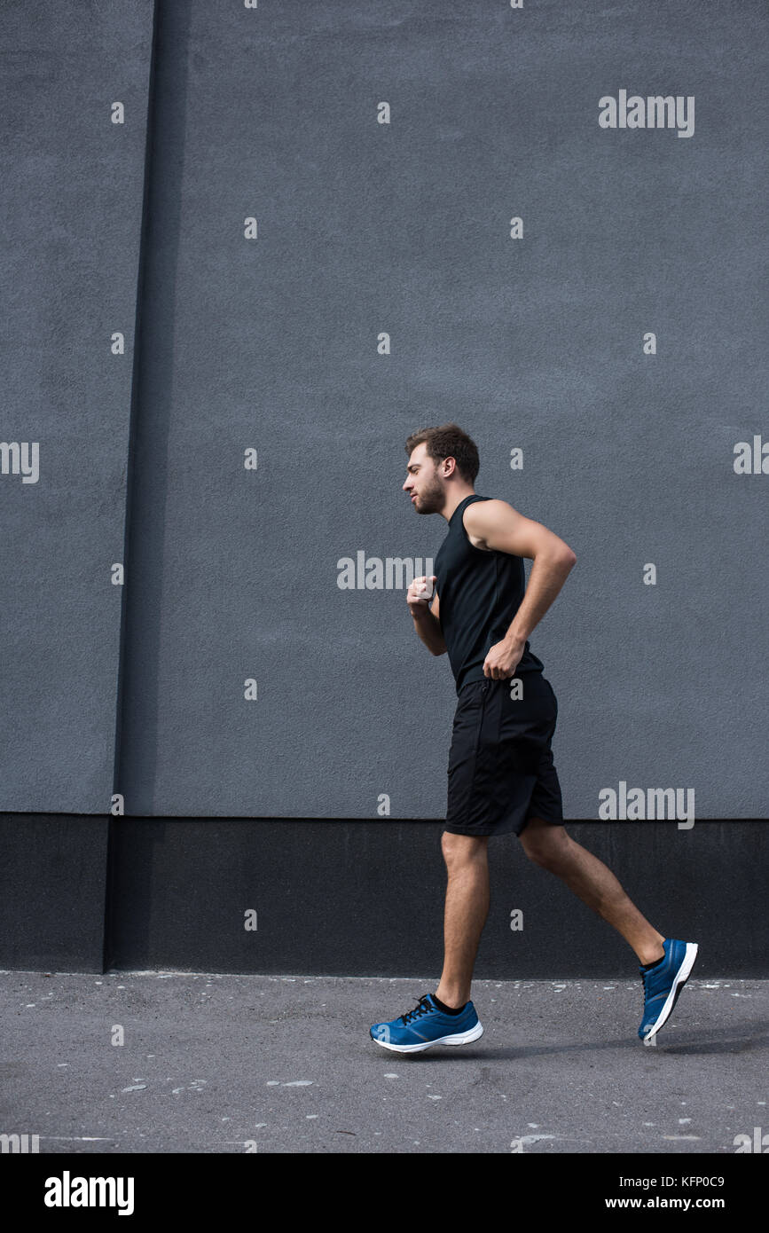 athletic sportsman jogging outside Stock Photo - Alamy