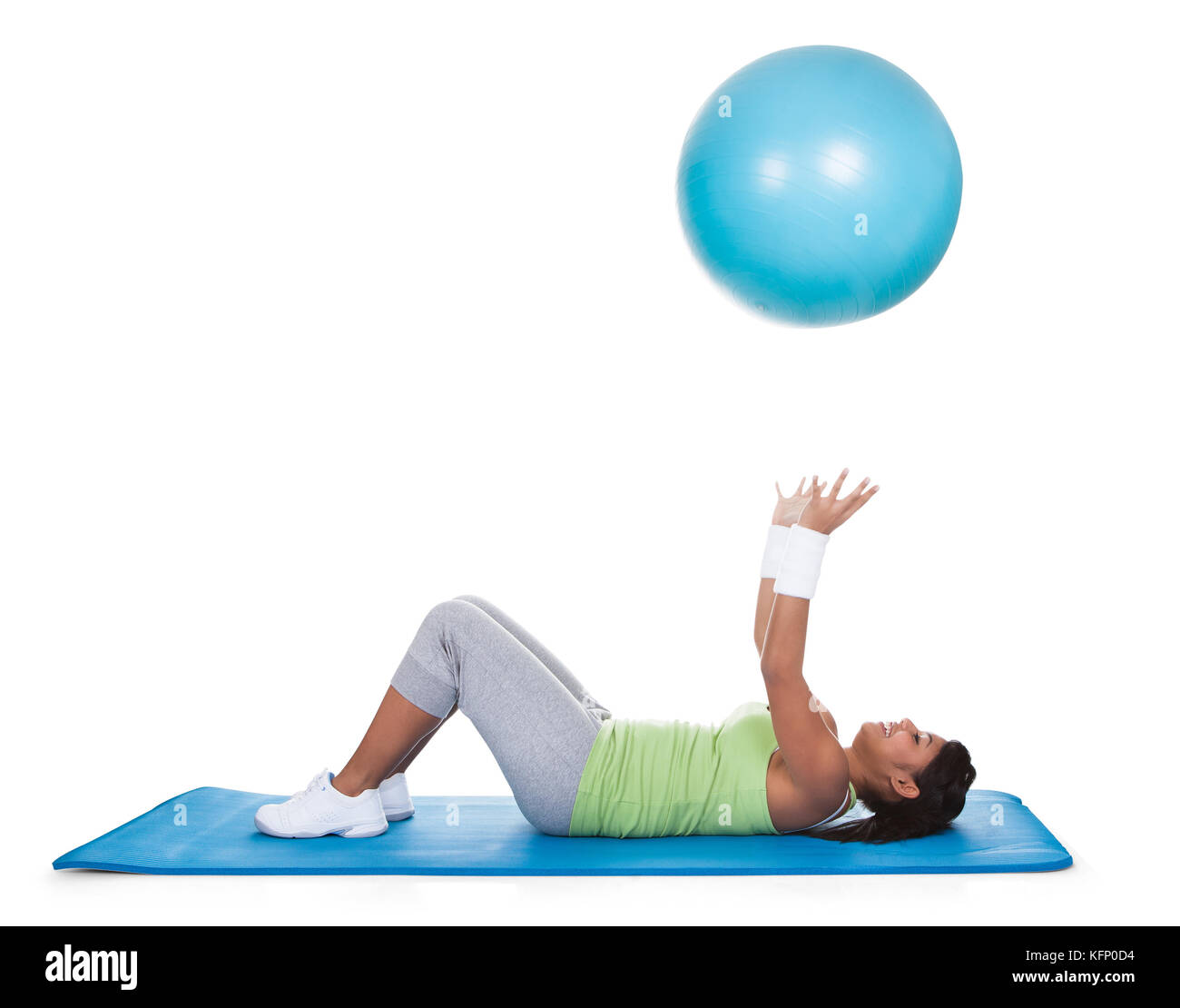 Woman Exercising On Fitness Ball Over White Background Stock Photo - Alamy