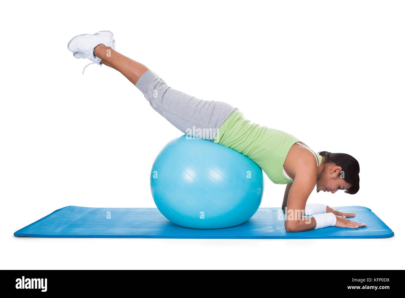 Woman Exercising On Fitness Ball Over White Background Stock Photo - Alamy