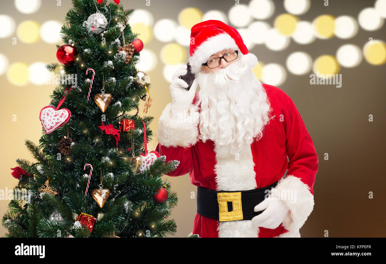 santa claus calling on smartphone at christmas Stock Photo - Alamy