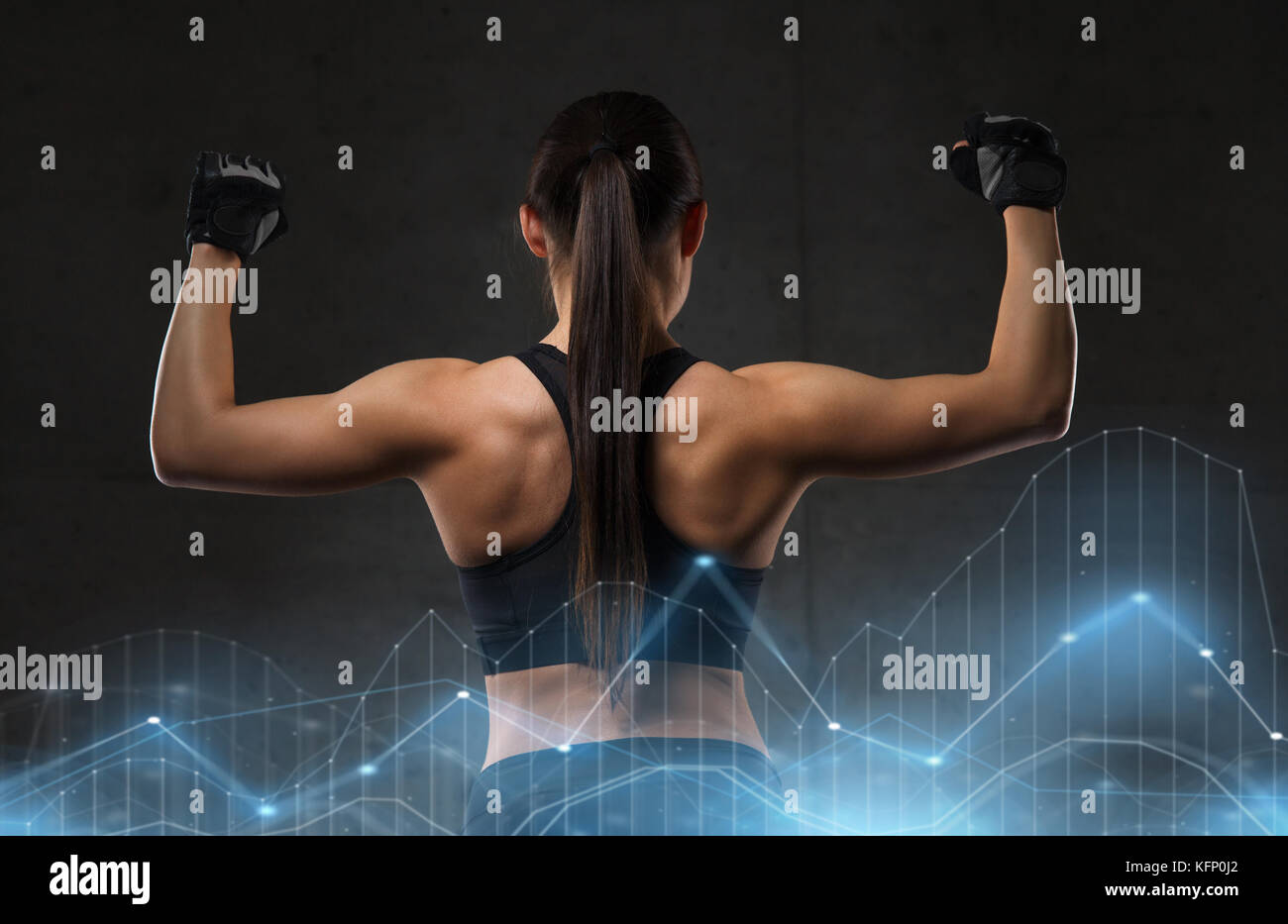 Rear view muscular woman flexing hi-res stock photography and images ...