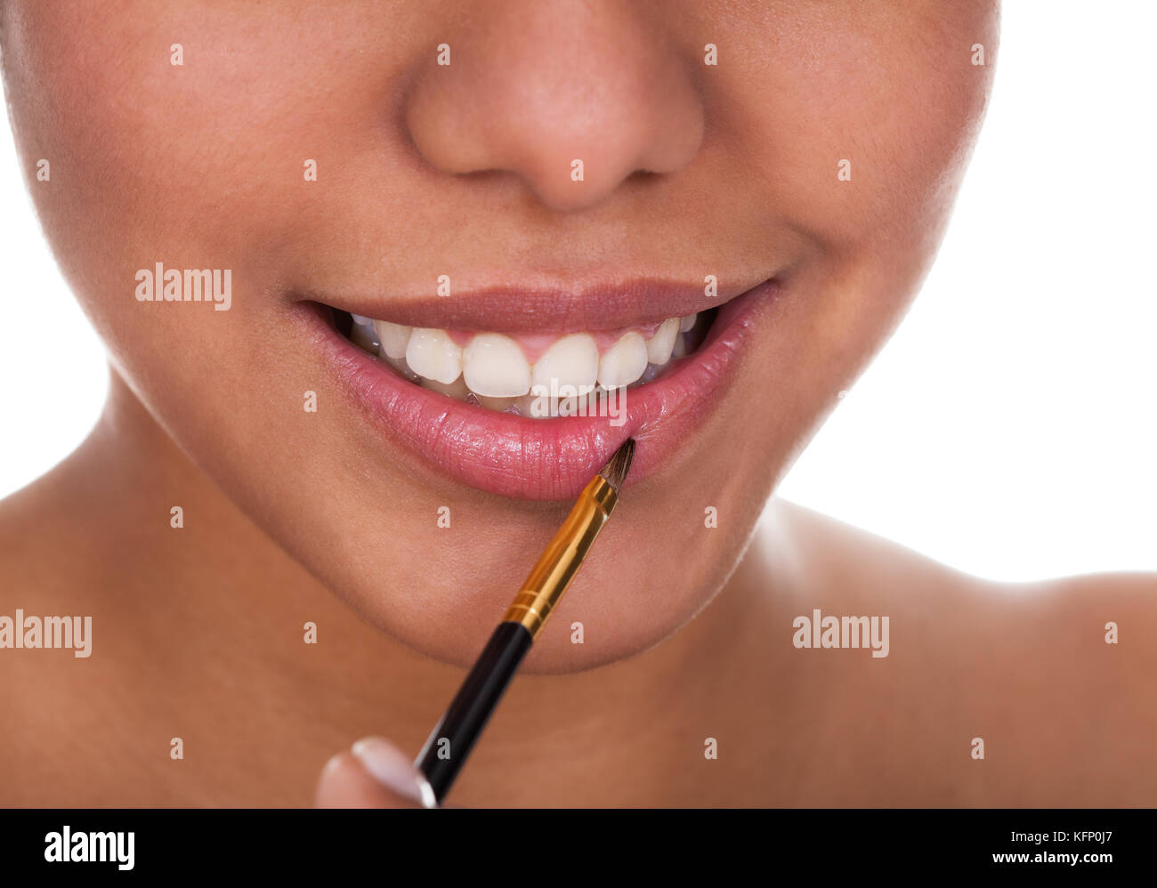 Young Woman Applying Lipstick Over White Background Stock Photo - Alamy