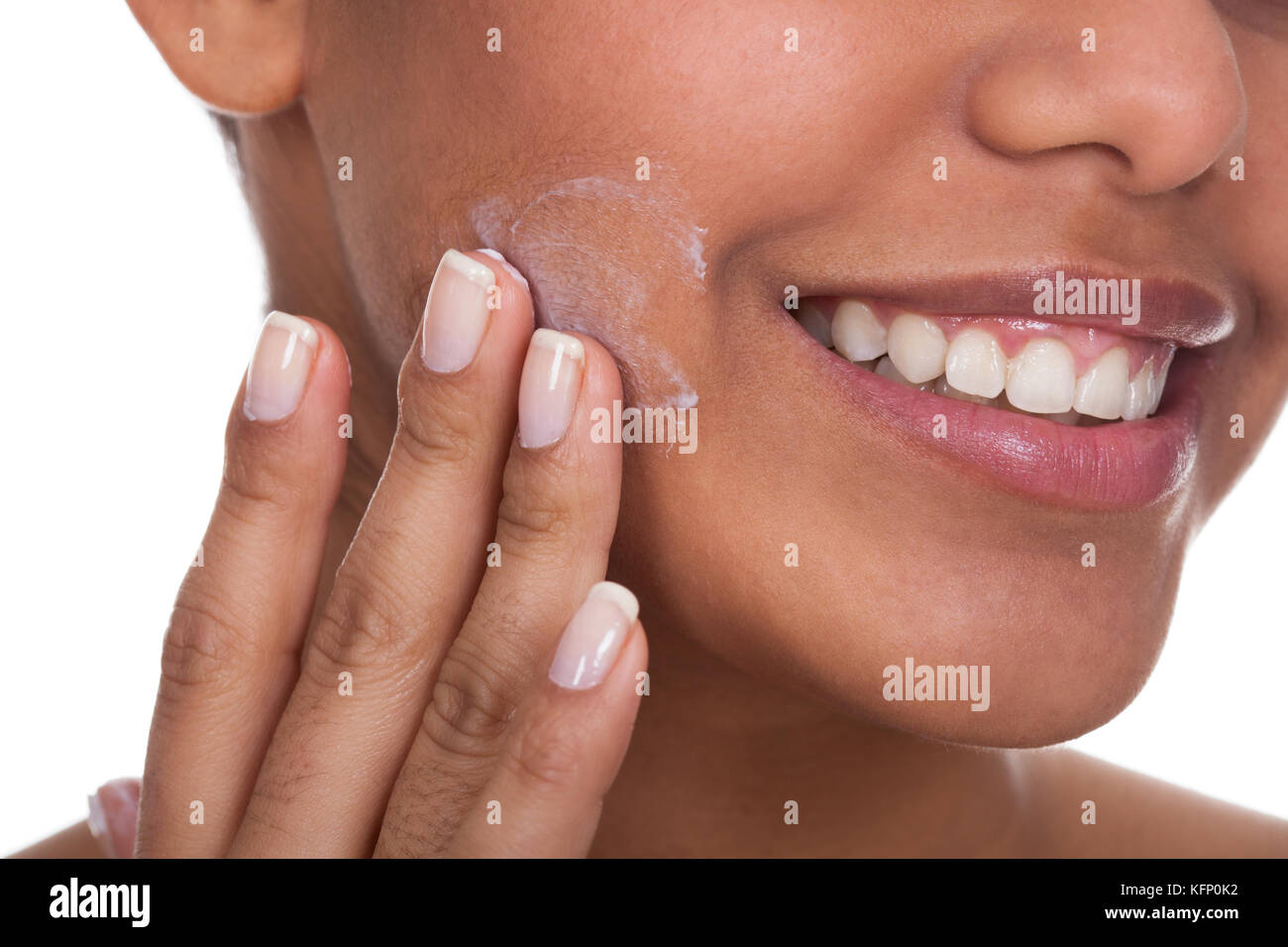 Young Woman Applying Cream On Her Face Over White Background Stock ...