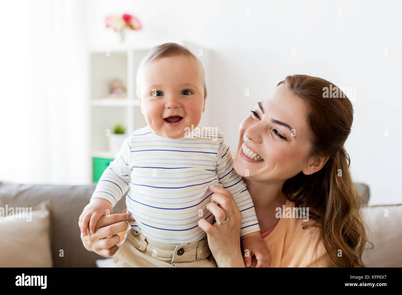 happy young mother with little baby at home Stock Photo - Alamy