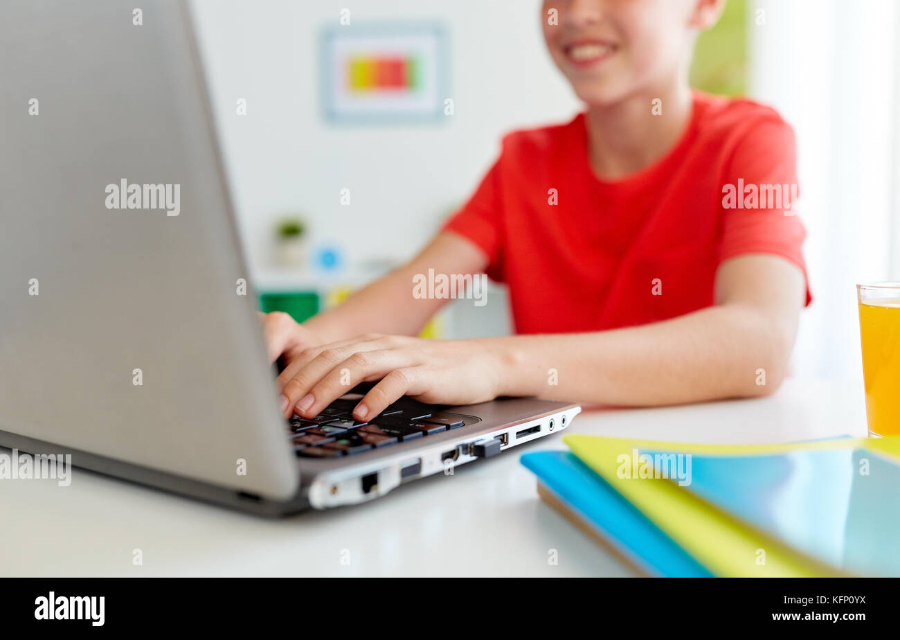 Boy typing hi-res stock photography and images - Alamy