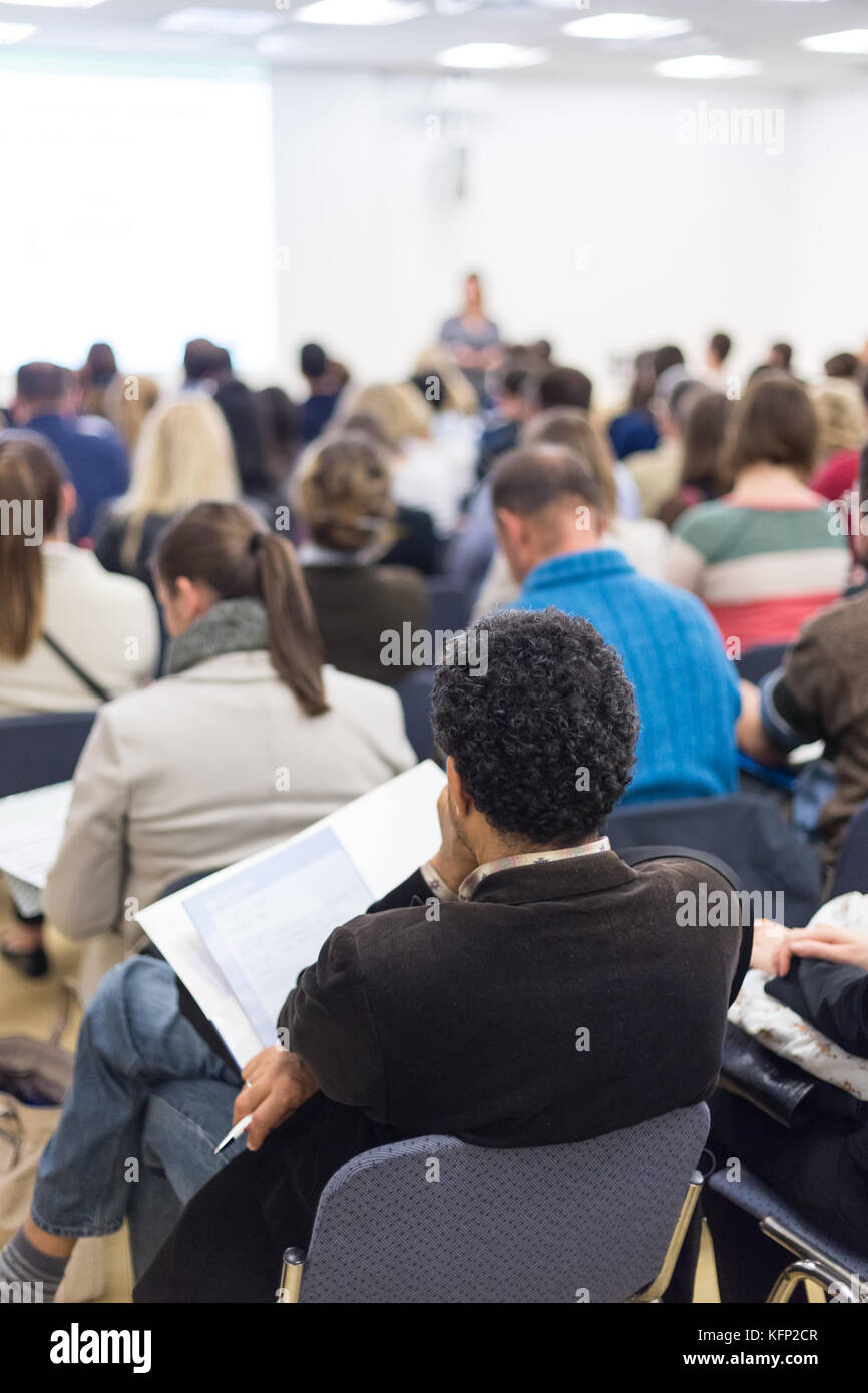 Woman giving presentation on business conference Stock Photo - Alamy