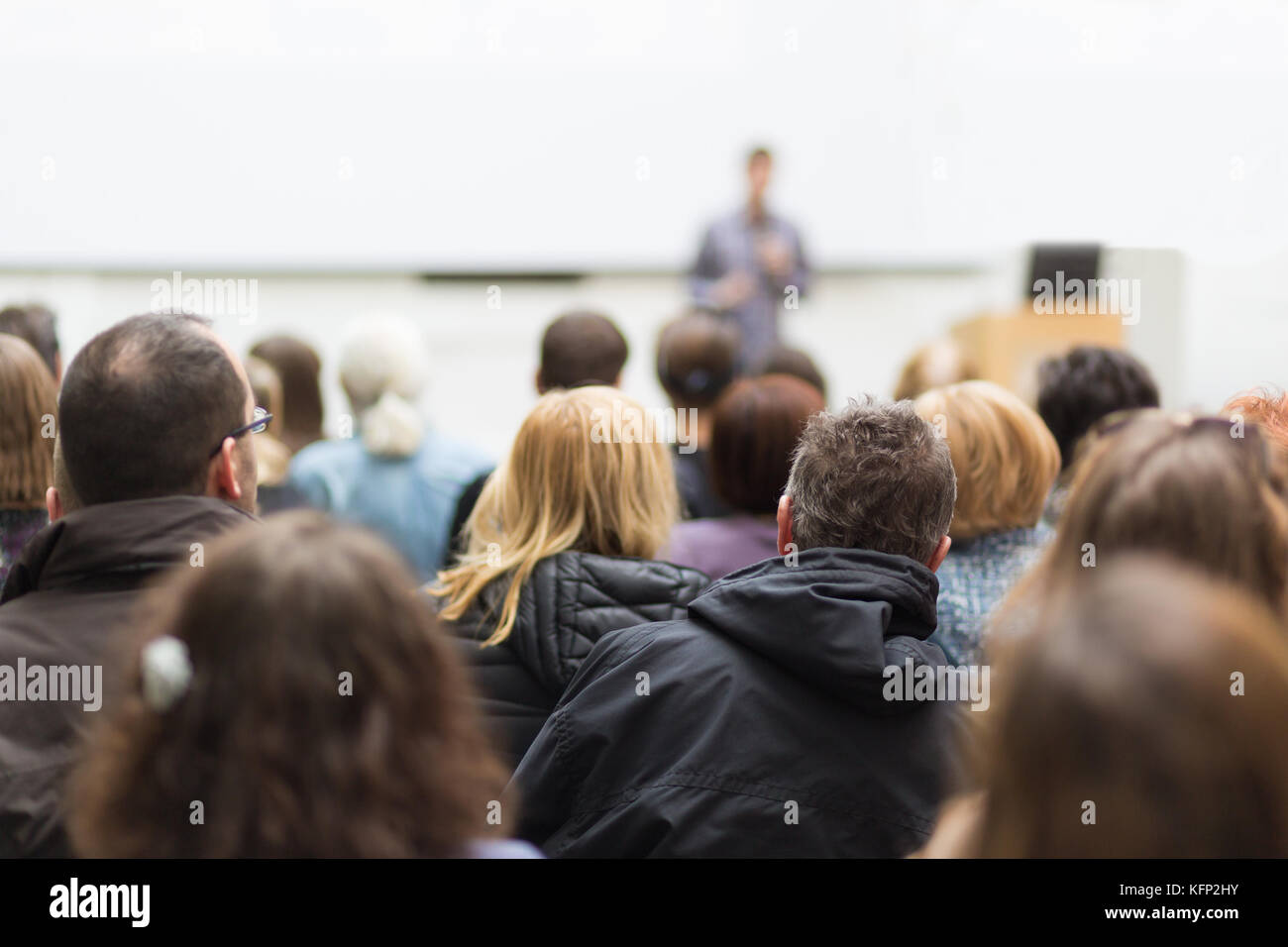 Man giving presentation in lecture hall at university Stock Photo - Alamy