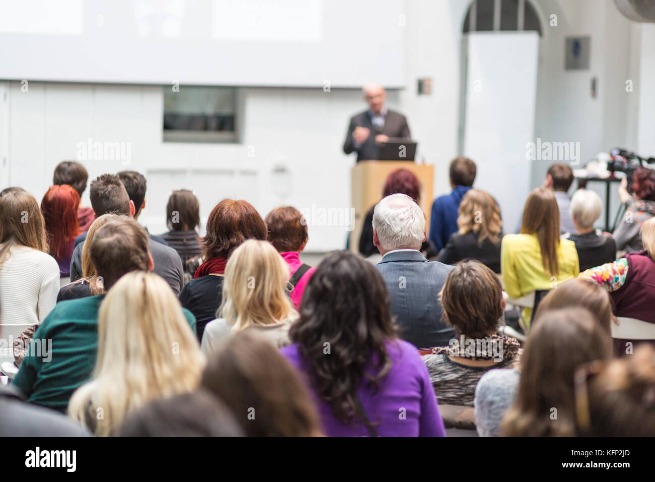 Man giving presentation in lecture hall at university Stock Photo - Alamy