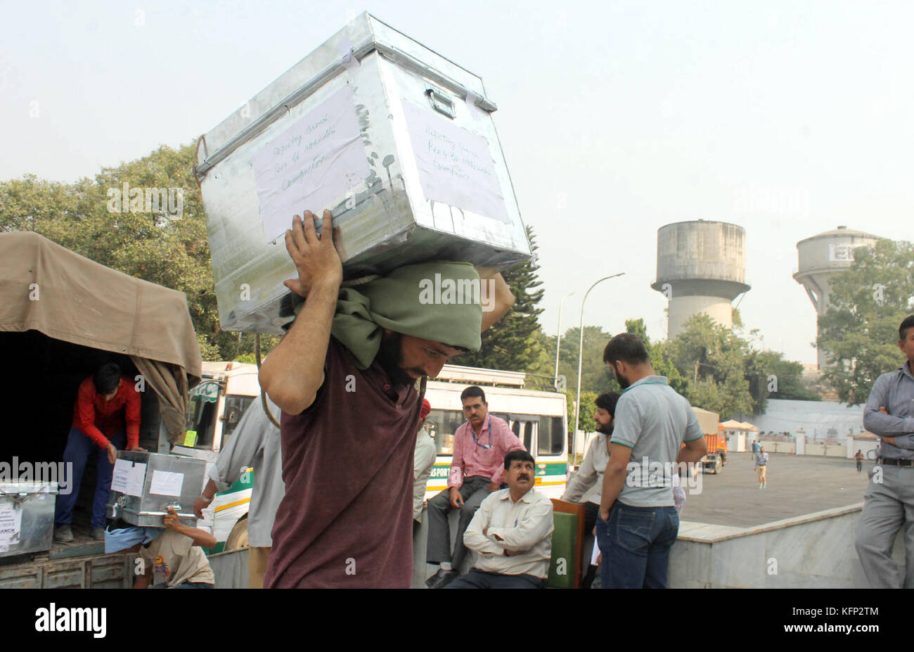 Carries two boxes hi-res stock photography and images - Alamy