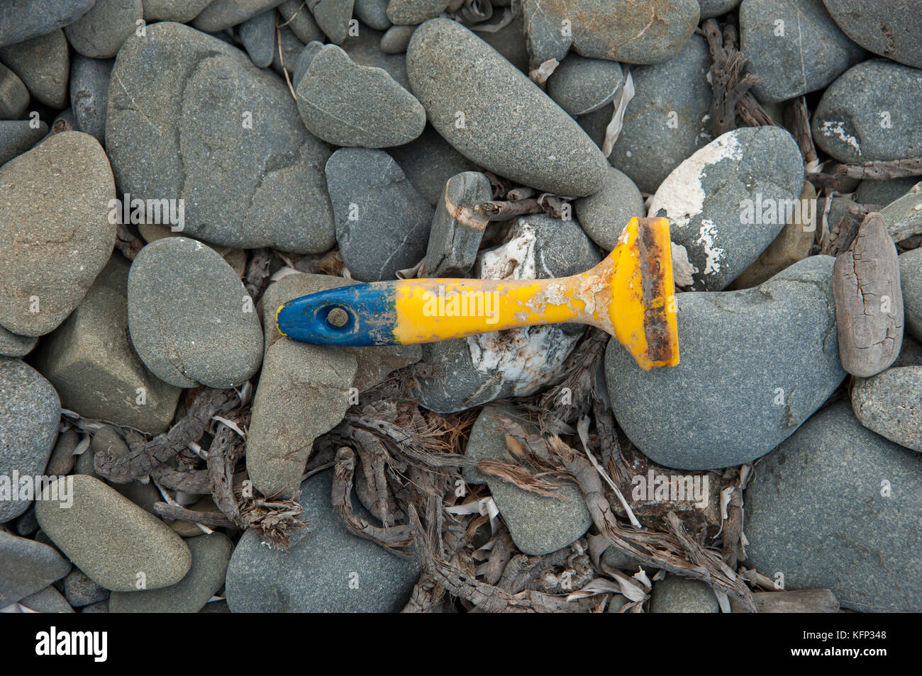 Washed up plastic flotsam and jetsam litter a beach on the island of ...