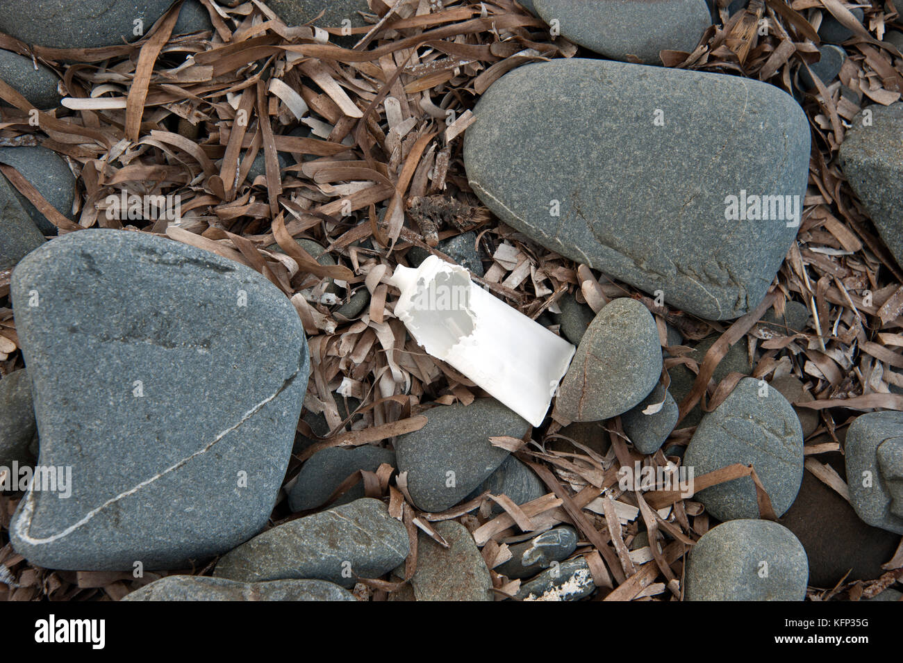 Washed up plastic flotsam and jetsam litter a beach on the island of ...